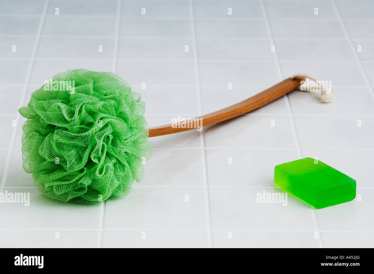 Bath scrubber and soap Stock Photo - Alamy