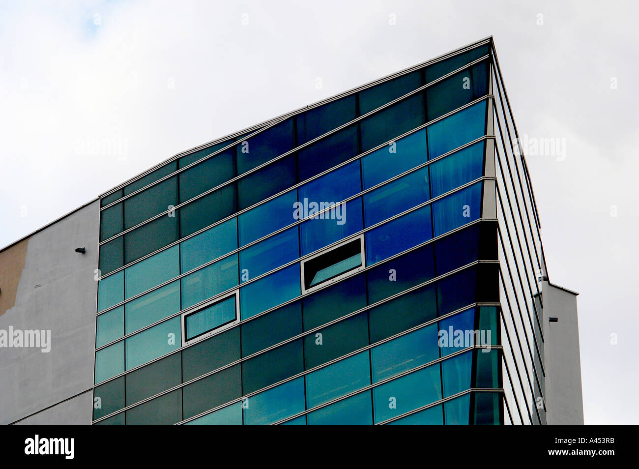 Modern Dutch building partially glazed with blue and green glass. in ...