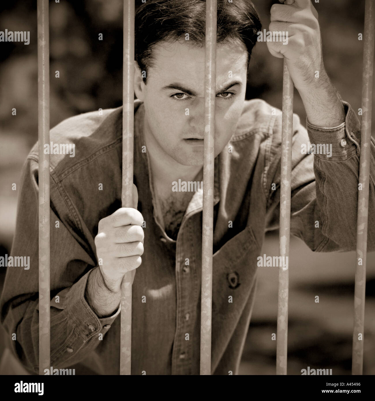 Males behind bars hi-res stock photography and images - Alamy