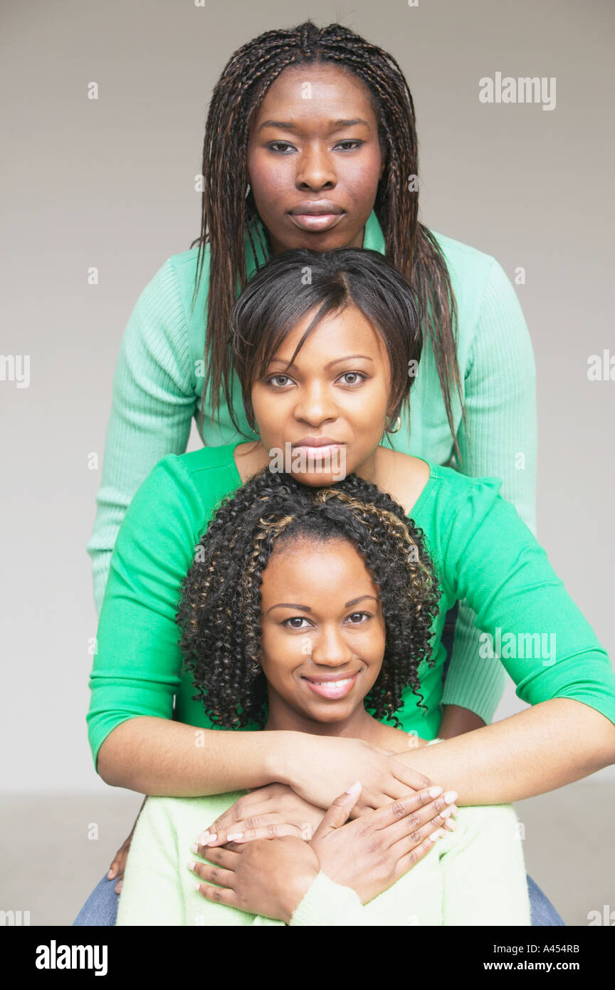 Three women in a row Stock Photo - Alamy