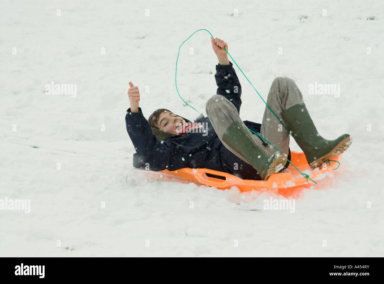 Boy on sledge in hi-res stock photography and images - Alamy