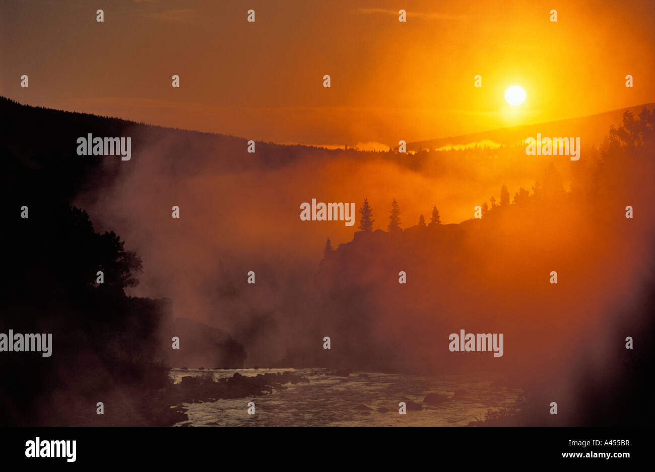Sunrise taken in the Swiftcurrent River at Many Glacier Glacier NP ...