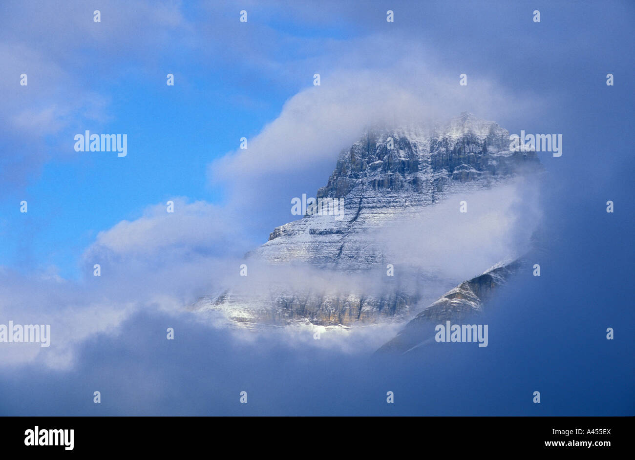 Close up of mountain peak sorrounded by the rainy clouds of a coming ...