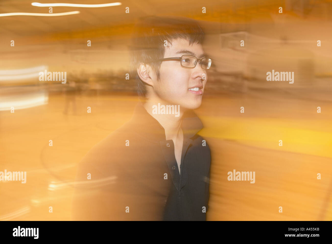 Side view of teenage boy in gymnasium Stock Photo - Alamy
