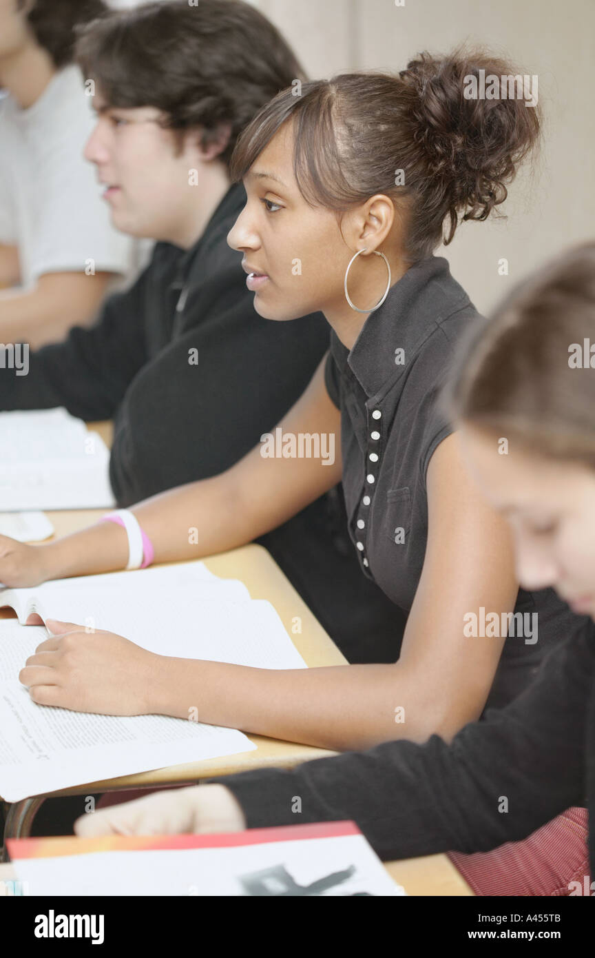 Four high school students in classroom Stock Photo - Alamy