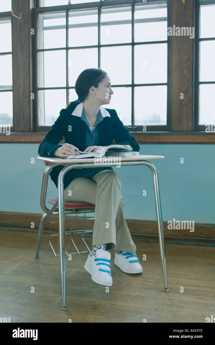 Female high school student at desk Stock Photo - Alamy