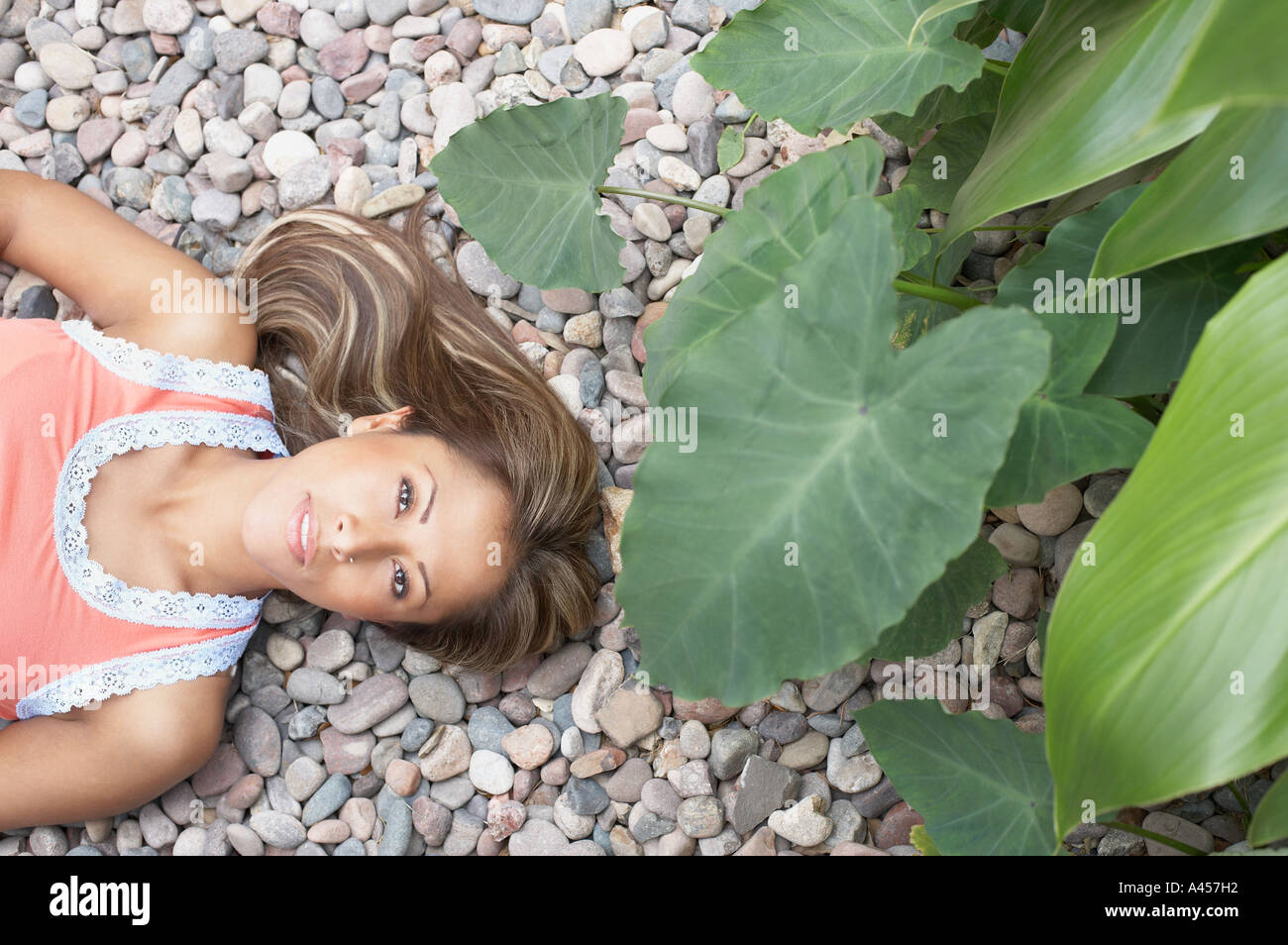 Young woman lying on back Stock Photo - Alamy