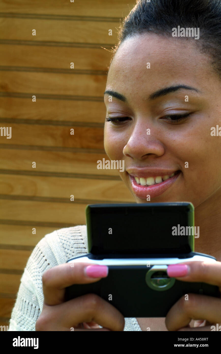 young woman sending a text message Stock Photo - Alamy