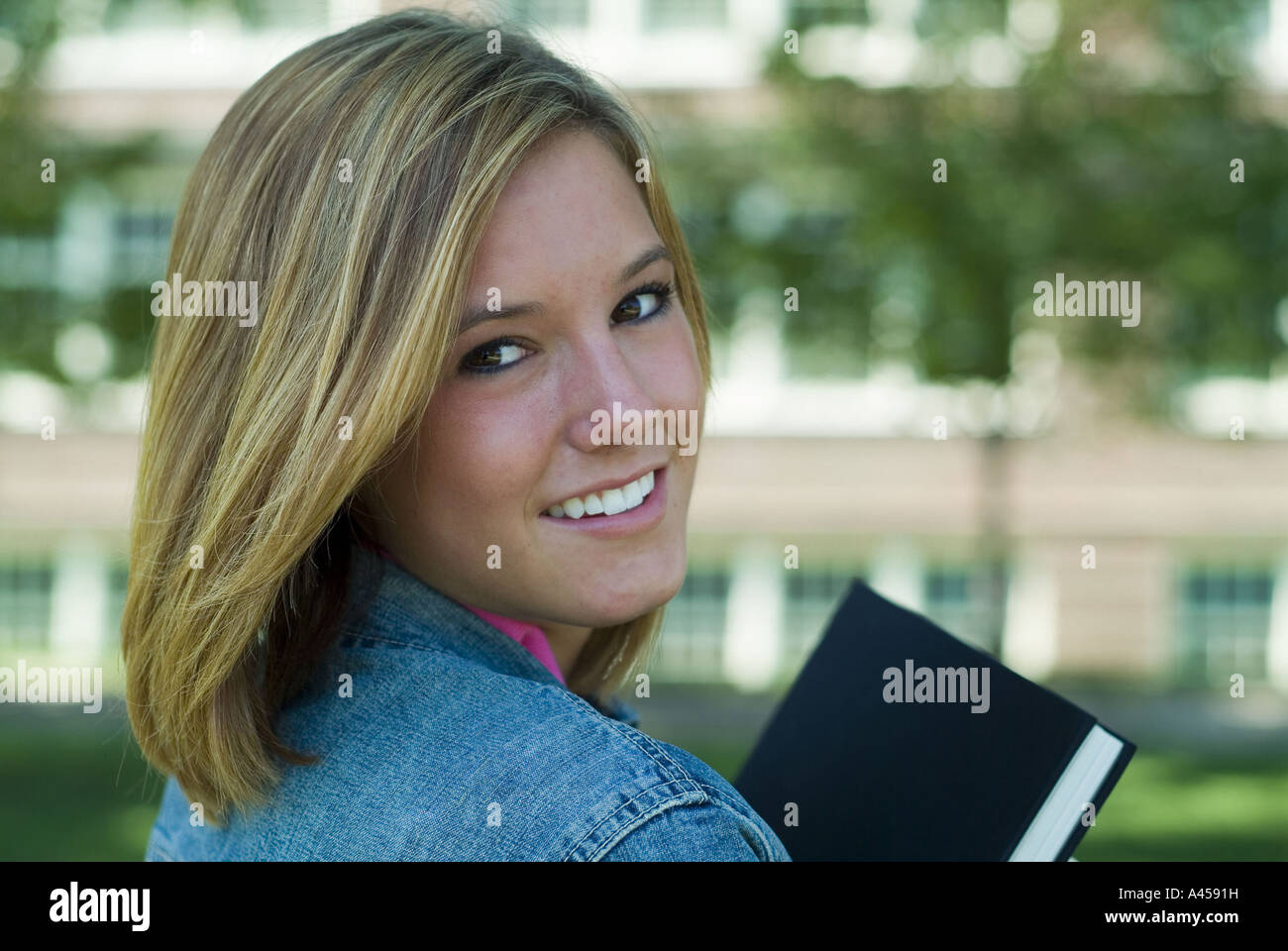 female student outside walking to class Stock Photo - Alamy
