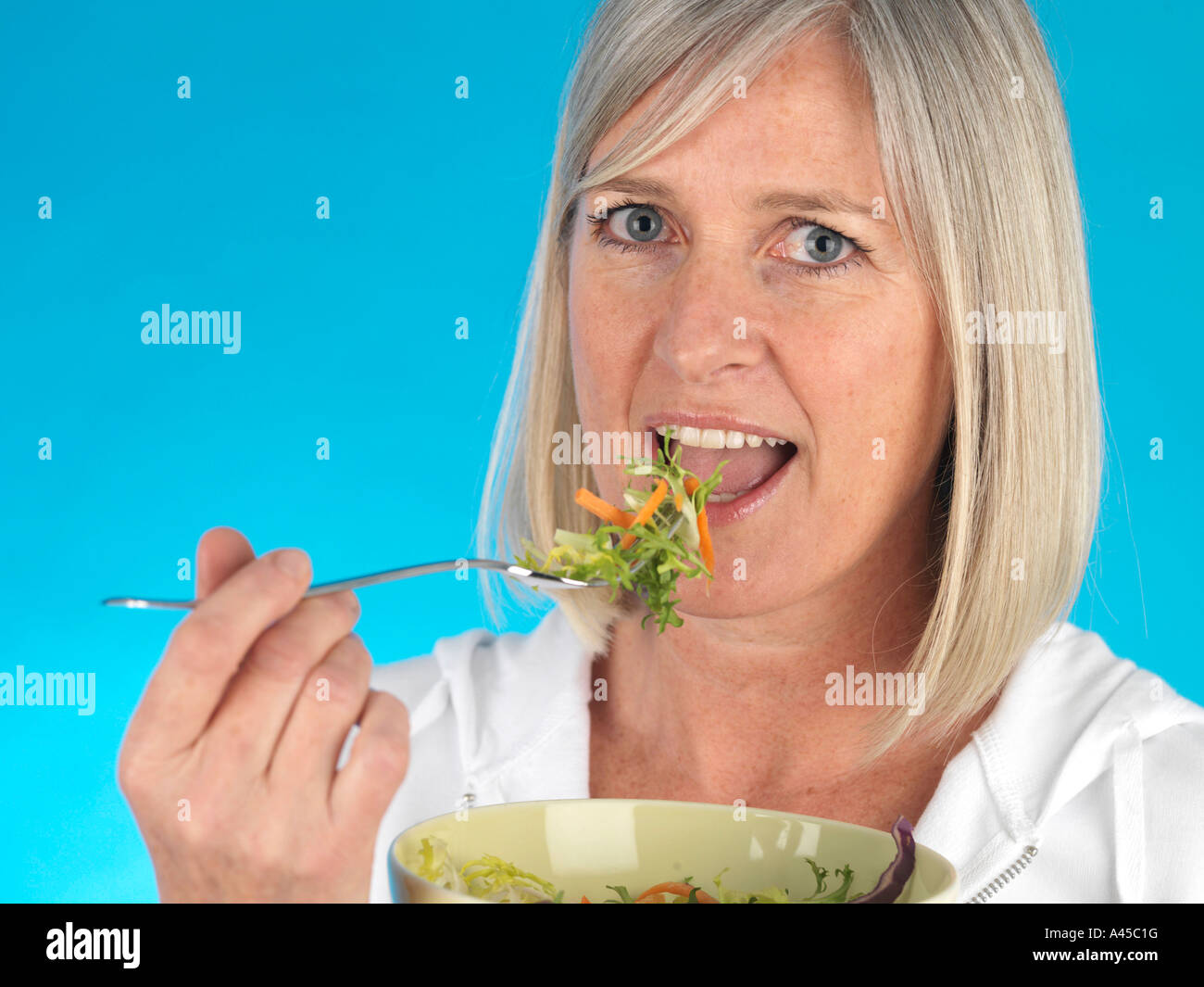 Mature Woman Eating Garden Salad Model Released Stock Photo - Alamy