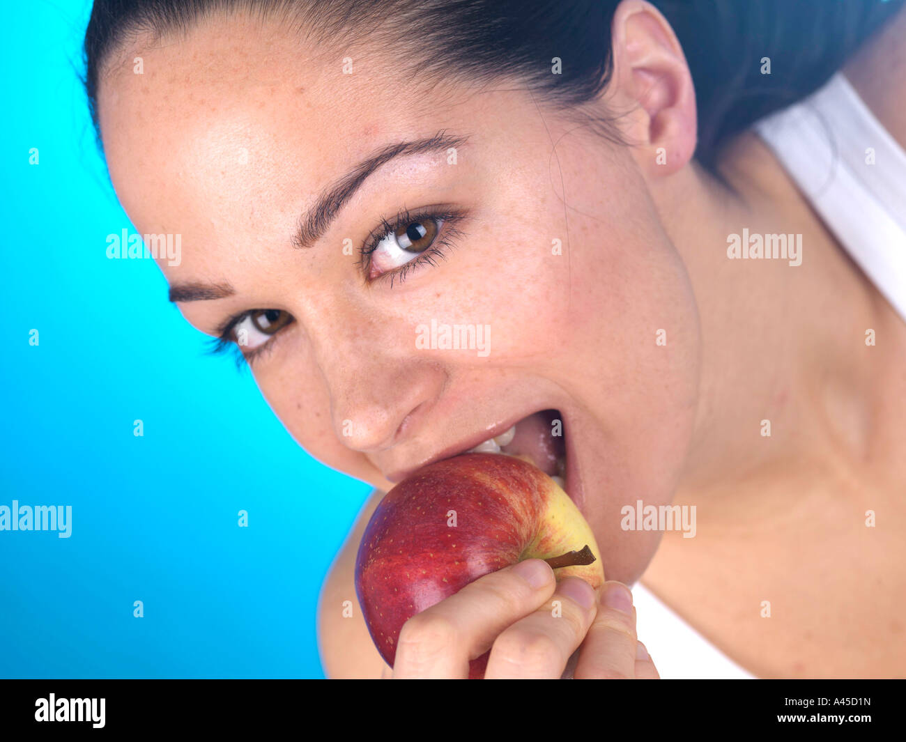 Young Woman Eating an Apple Model Released Stock Photo - Alamy