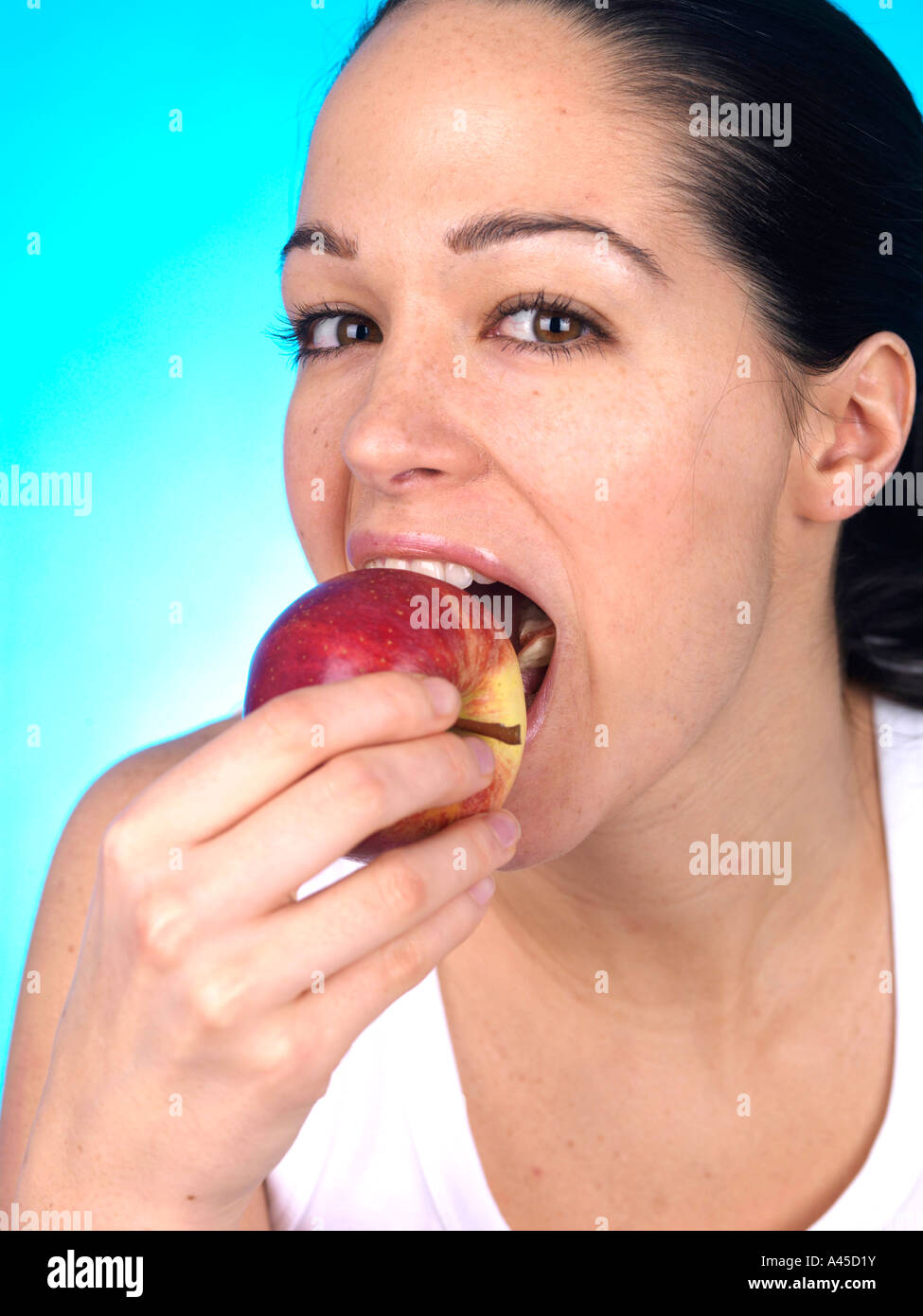 Young Woman Eating an Apple Model Released Stock Photo - Alamy