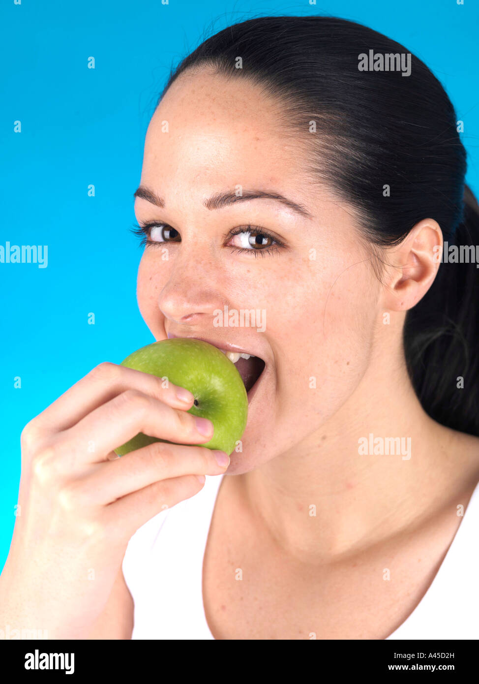 Young Woman Eating an Apple Model Released Stock Photo - Alamy