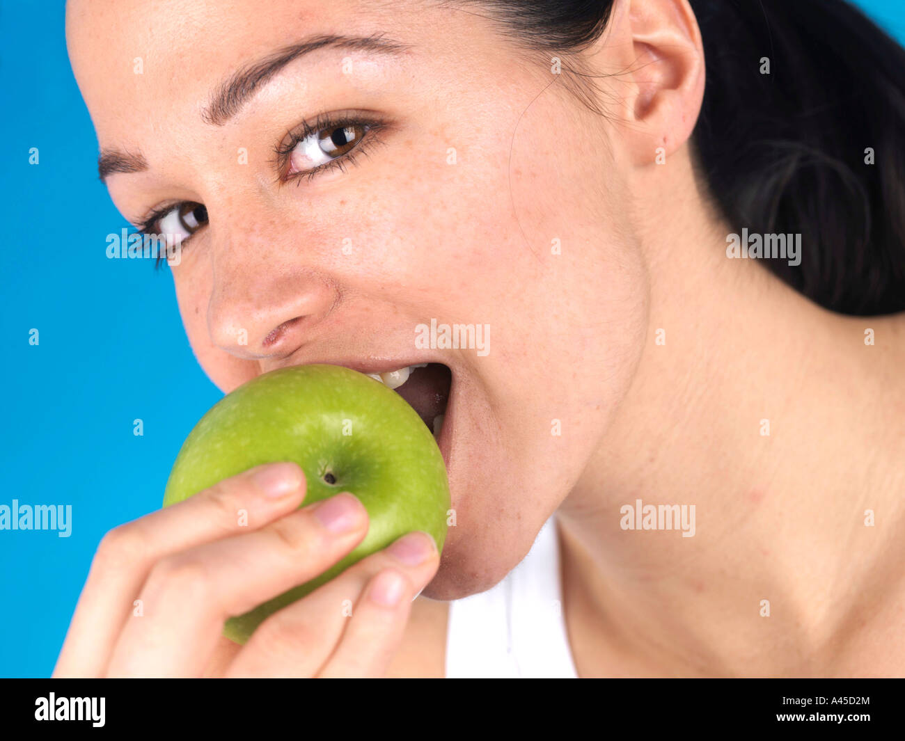 Young Woman Eating an Apple Model Released Stock Photo - Alamy
