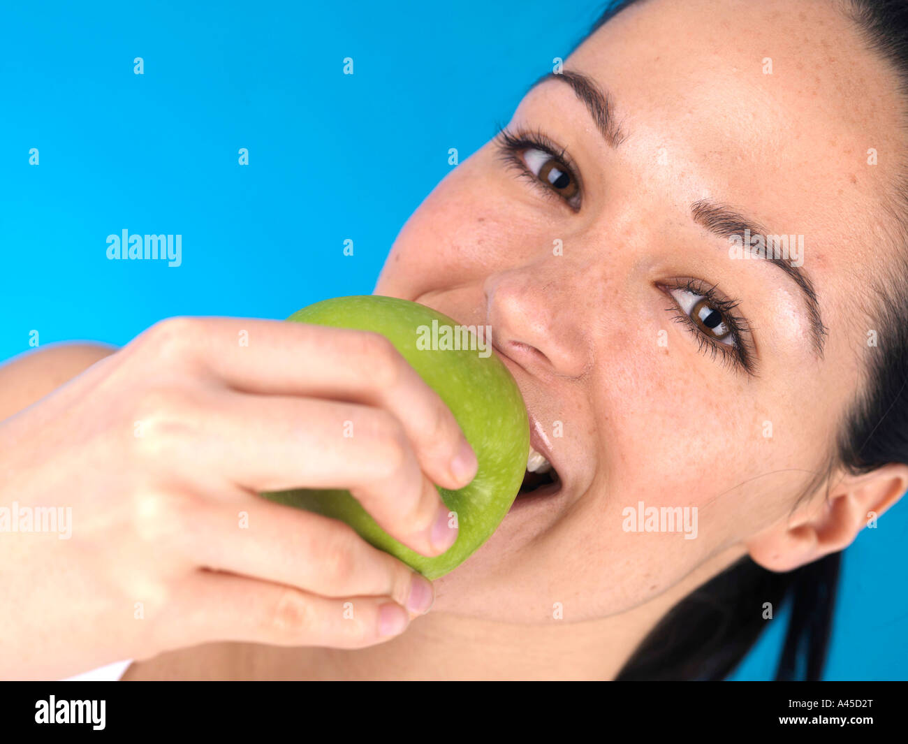 Young Woman Eating an Apple Model Released Stock Photo - Alamy