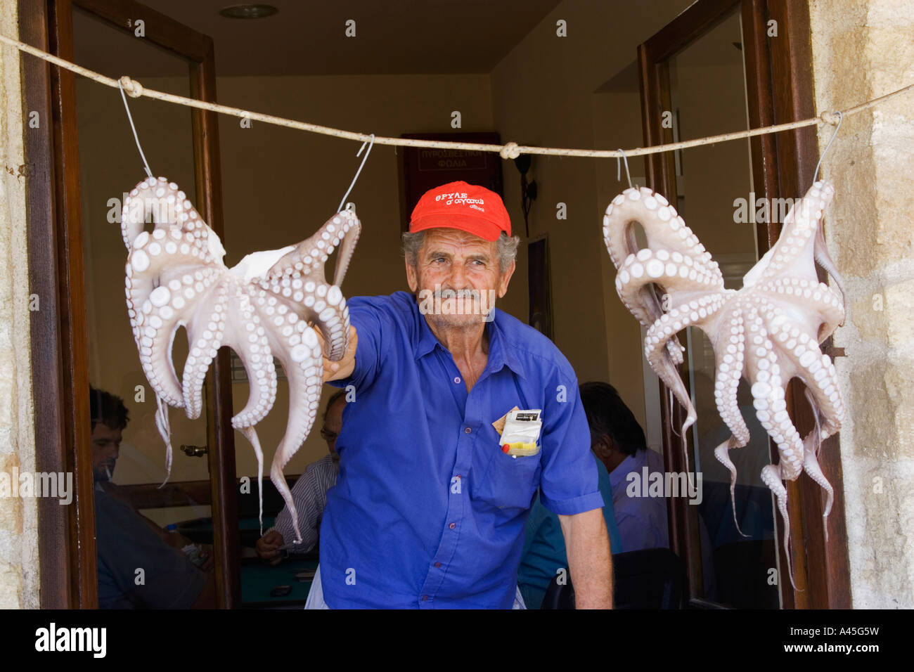 Greek octopus fisherman hi-res stock photography and images - Alamy