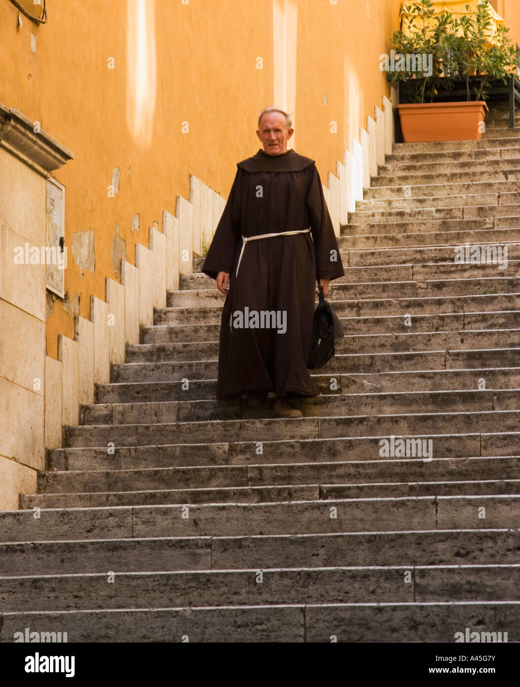 Monk walking down stairs hi-res stock photography and images - Alamy
