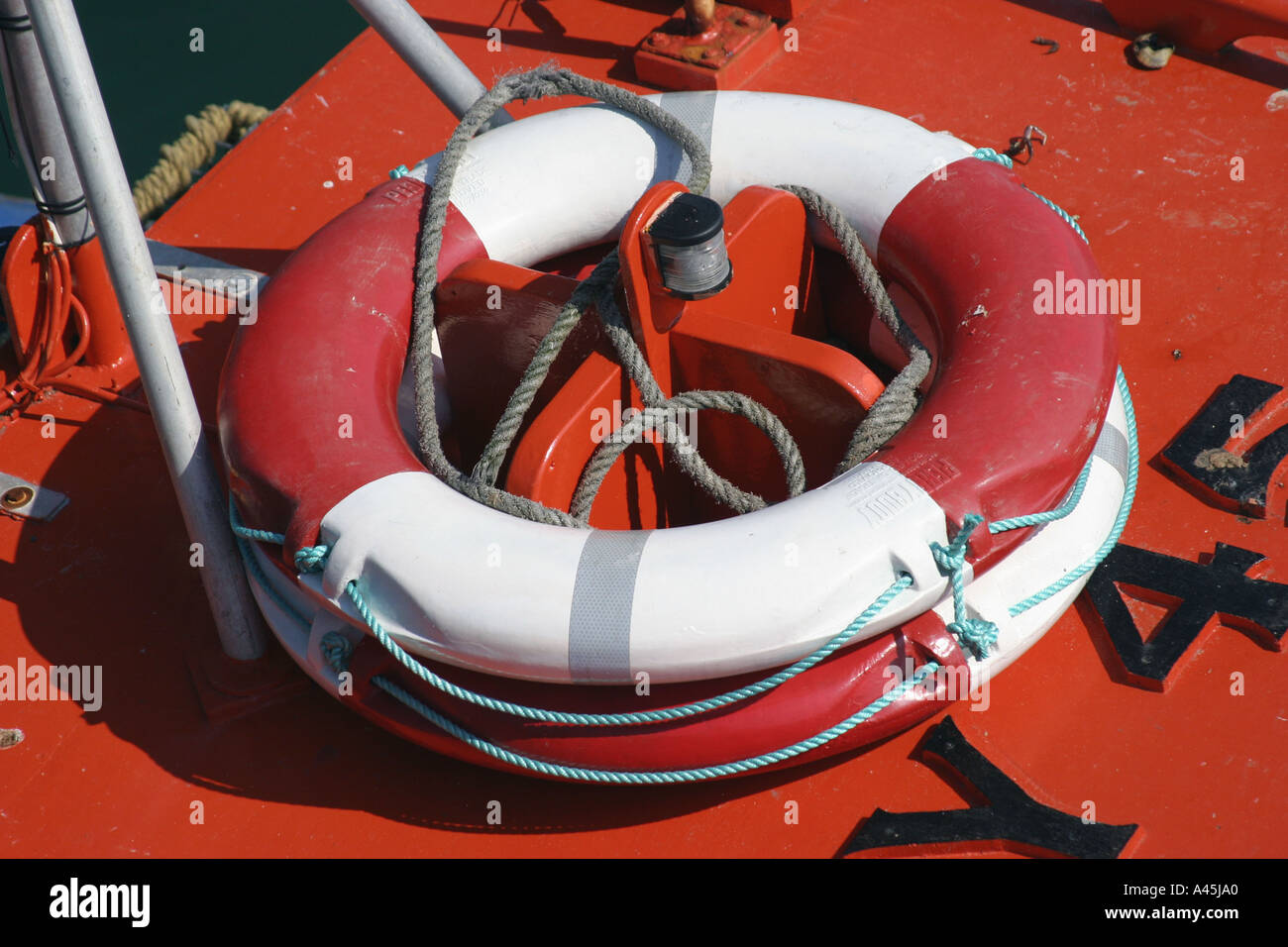 Life belt attached to a boat Stock Photo - Alamy