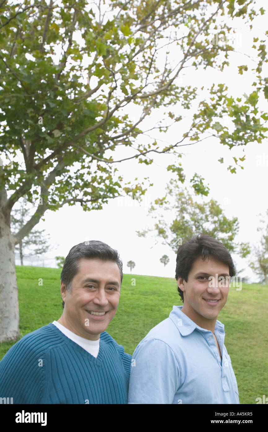 Portrait of father and son in a park Stock Photo - Alamy