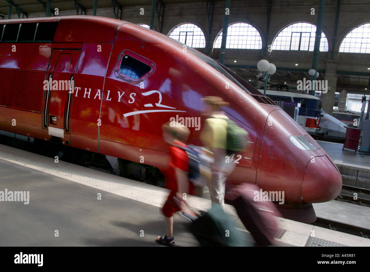 passengers board the thalys trans european train at the gare du nord ...