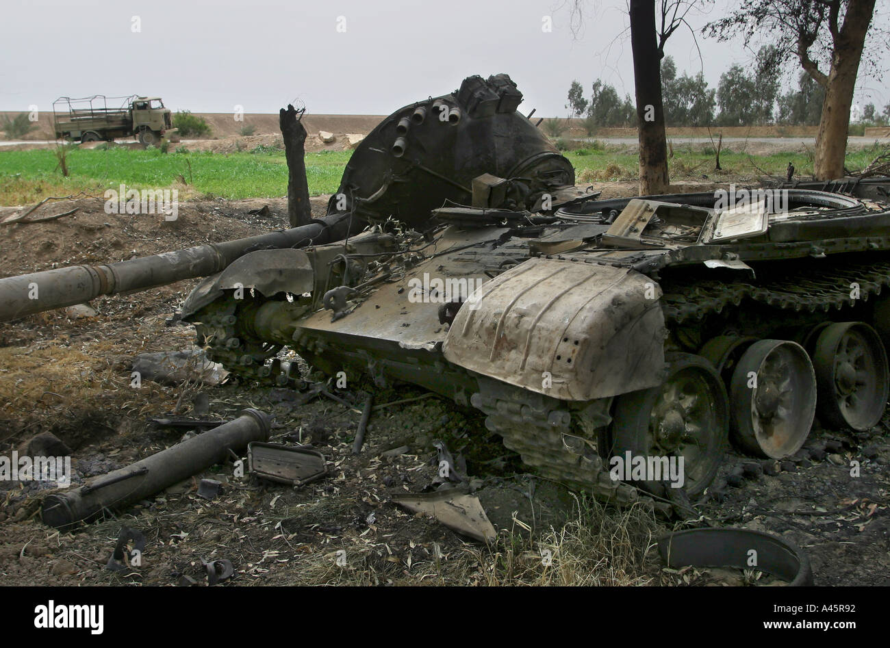 an iraqi tank on the outskirts of baghdad lies destroyed after a us ...
