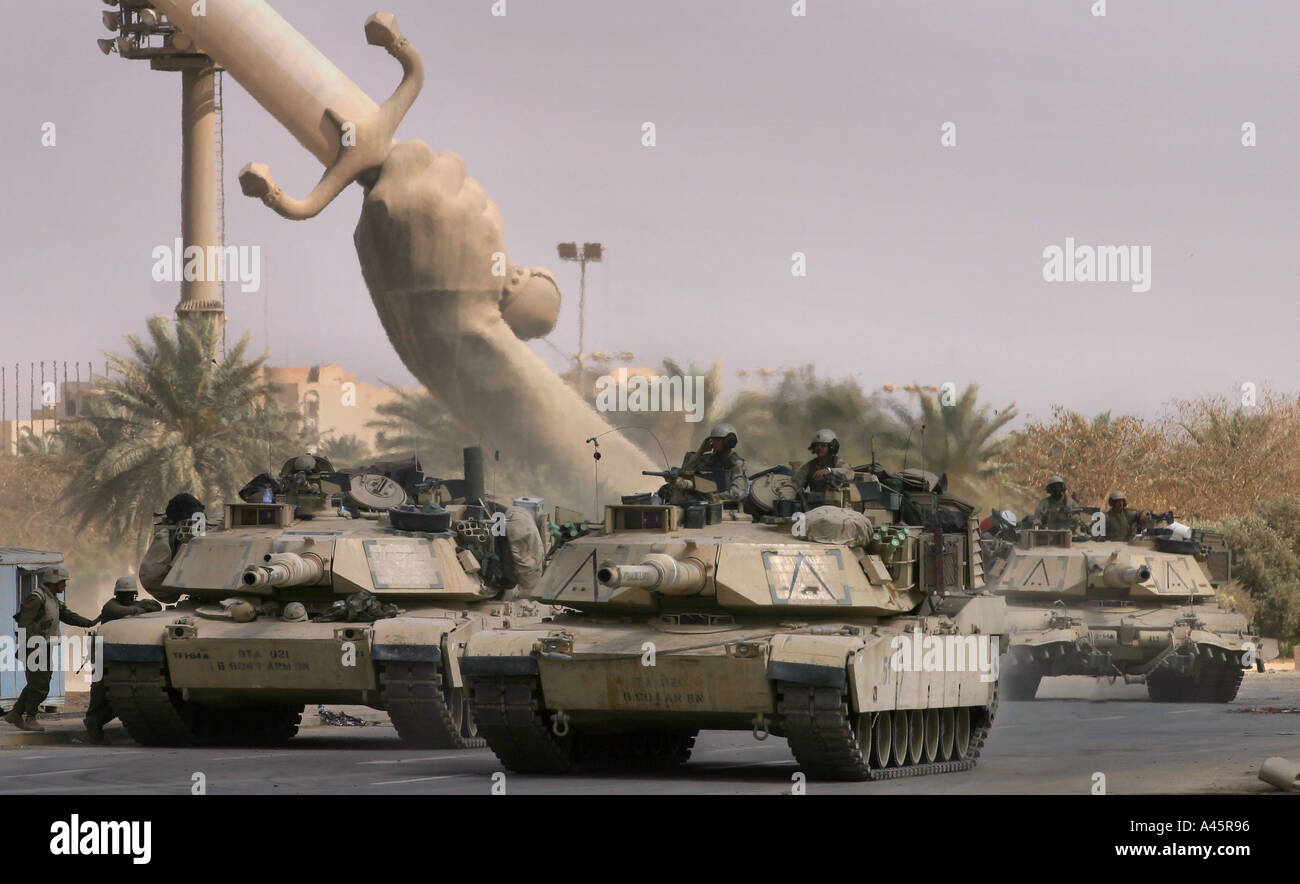us tanks patrol past the iran iraq war memorial in central baghdad ...