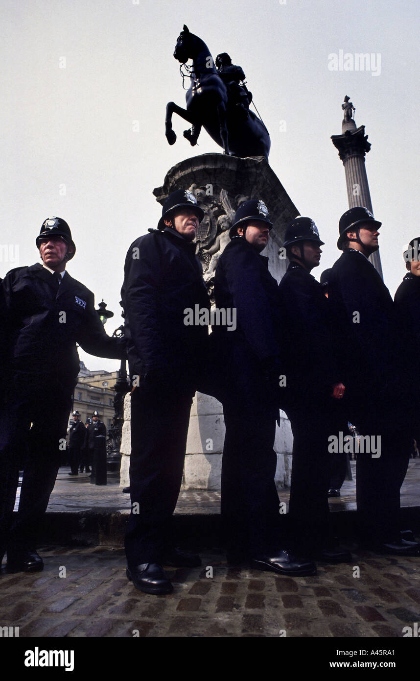 british police officers line up to guard trafalgar square during a ...