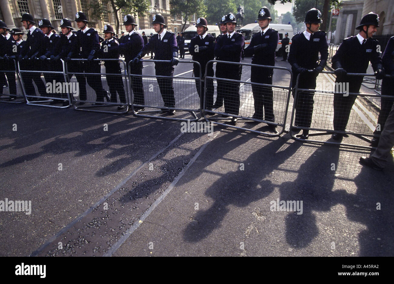 british police officers line up to guard whitehall during a march to ...