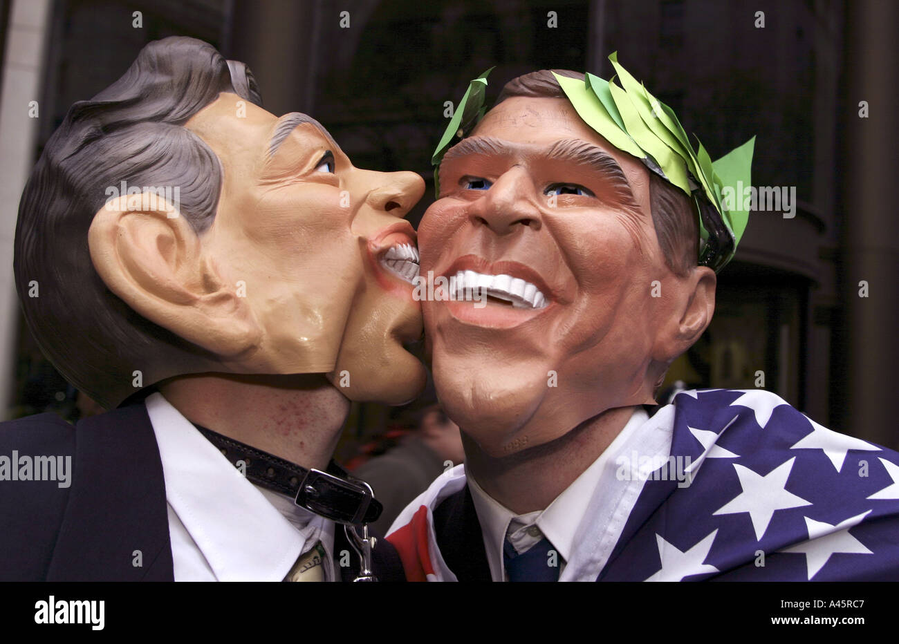 british demonstrators wear masks of us president george w bush and uk ...