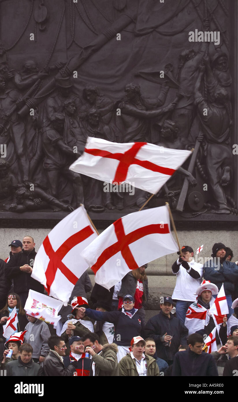 england fans wave flags and celebrate as the england rugby team mark ...