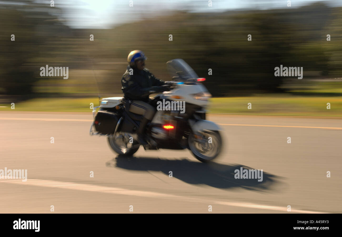 Police man in pursuit on a motorcycle Stock Photo - Alamy