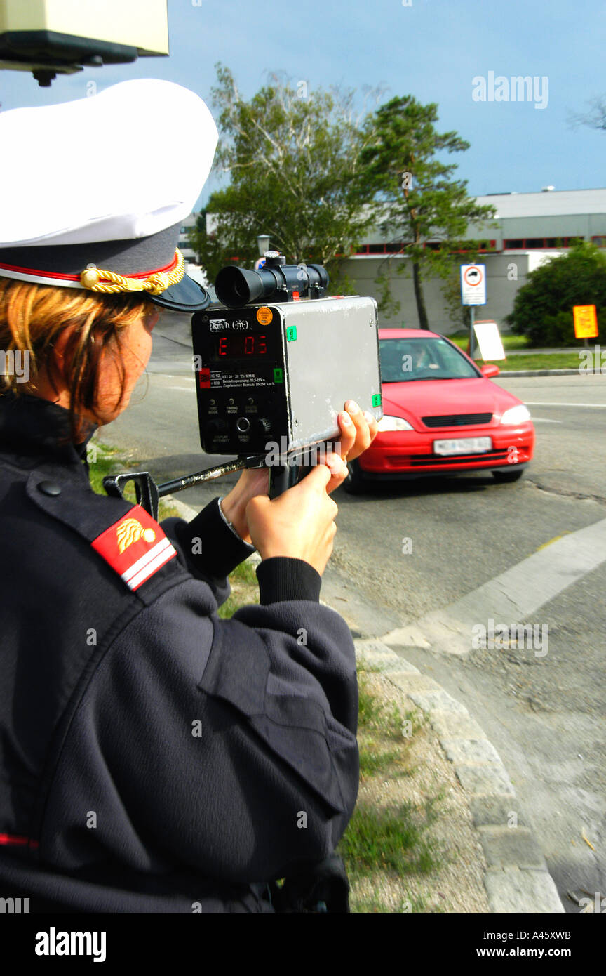 MR A Police Officer measuring speed with a Laser Gun Stock Photo - Alamy