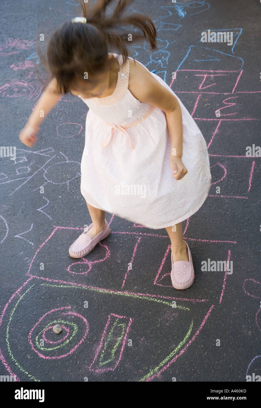Child hopping hopscotch hi-res stock photography and images - Alamy