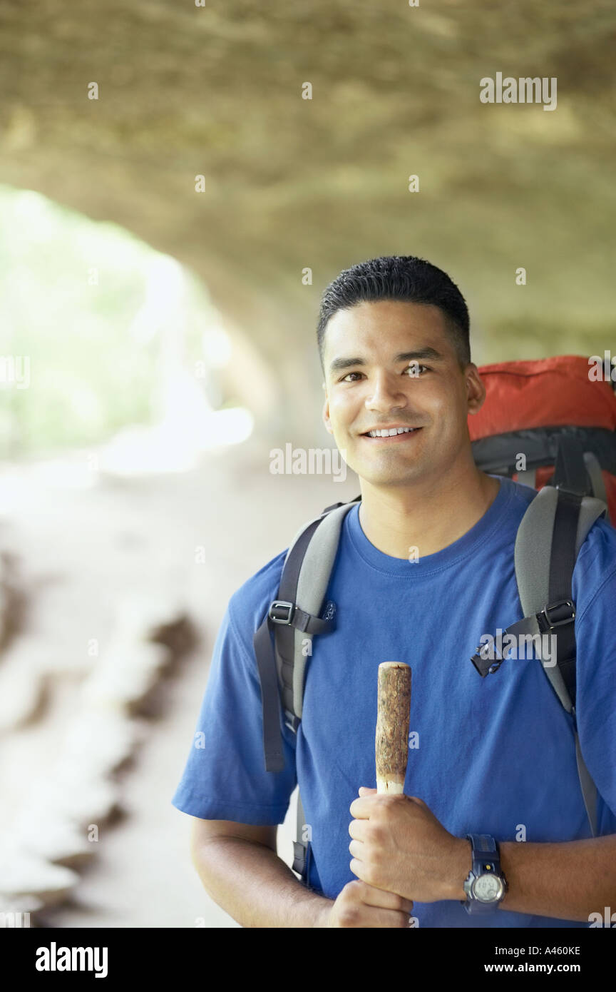 Young man hiking on a trail Stock Photo - Alamy