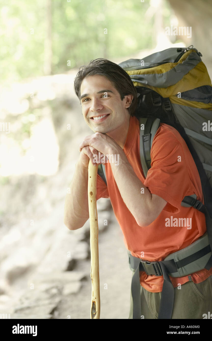 Young man hiking on a trail Stock Photo - Alamy