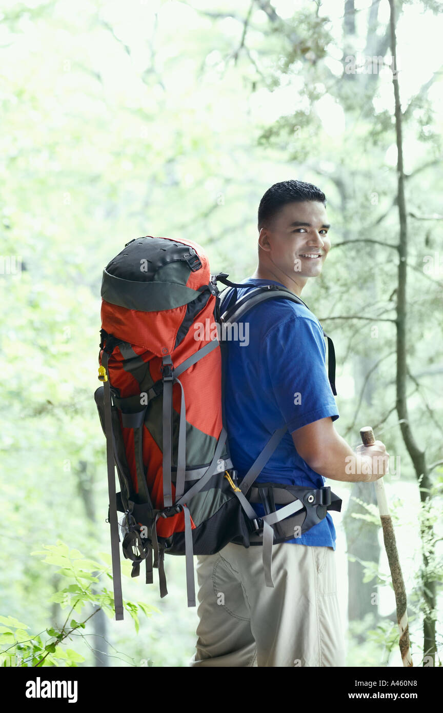 Handsome young man hiking in forest 20s adult hi-res stock photography ...