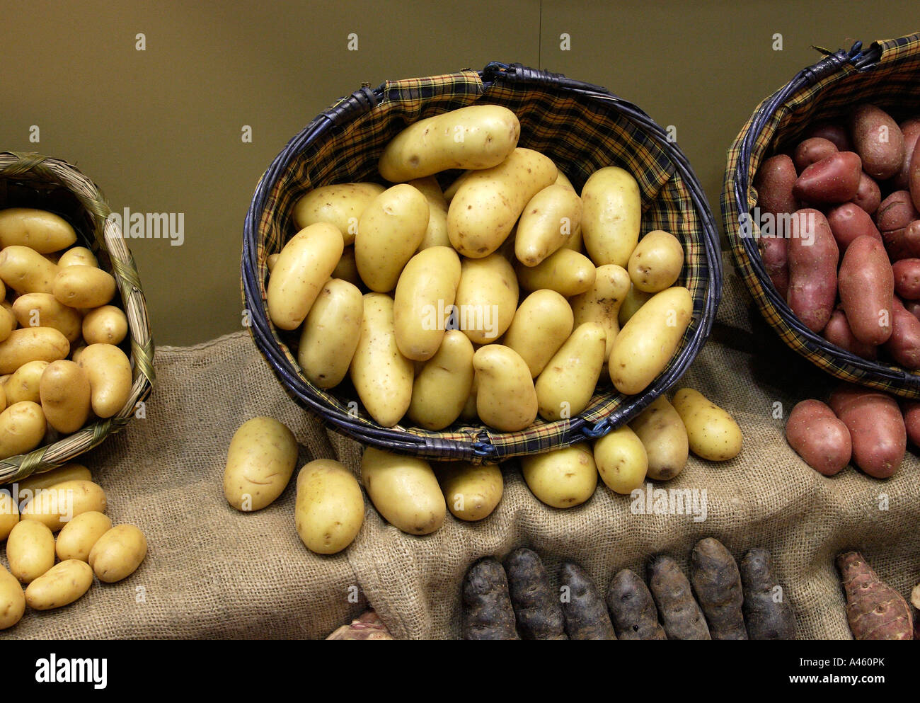 Different kinds of potatoes in baskets Stock Photo - Alamy