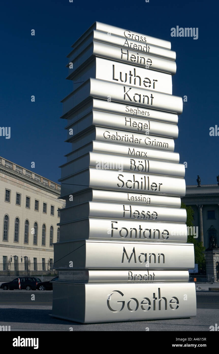 Sculpture of a pile of oversize books, part of the project Land of ...