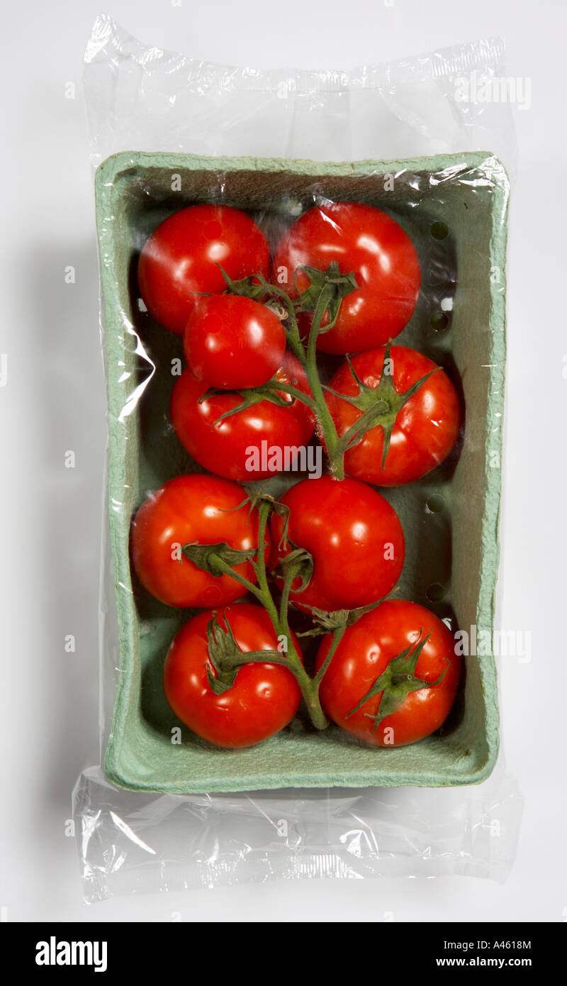 Packed tomatoes on white background Stock Photo - Alamy