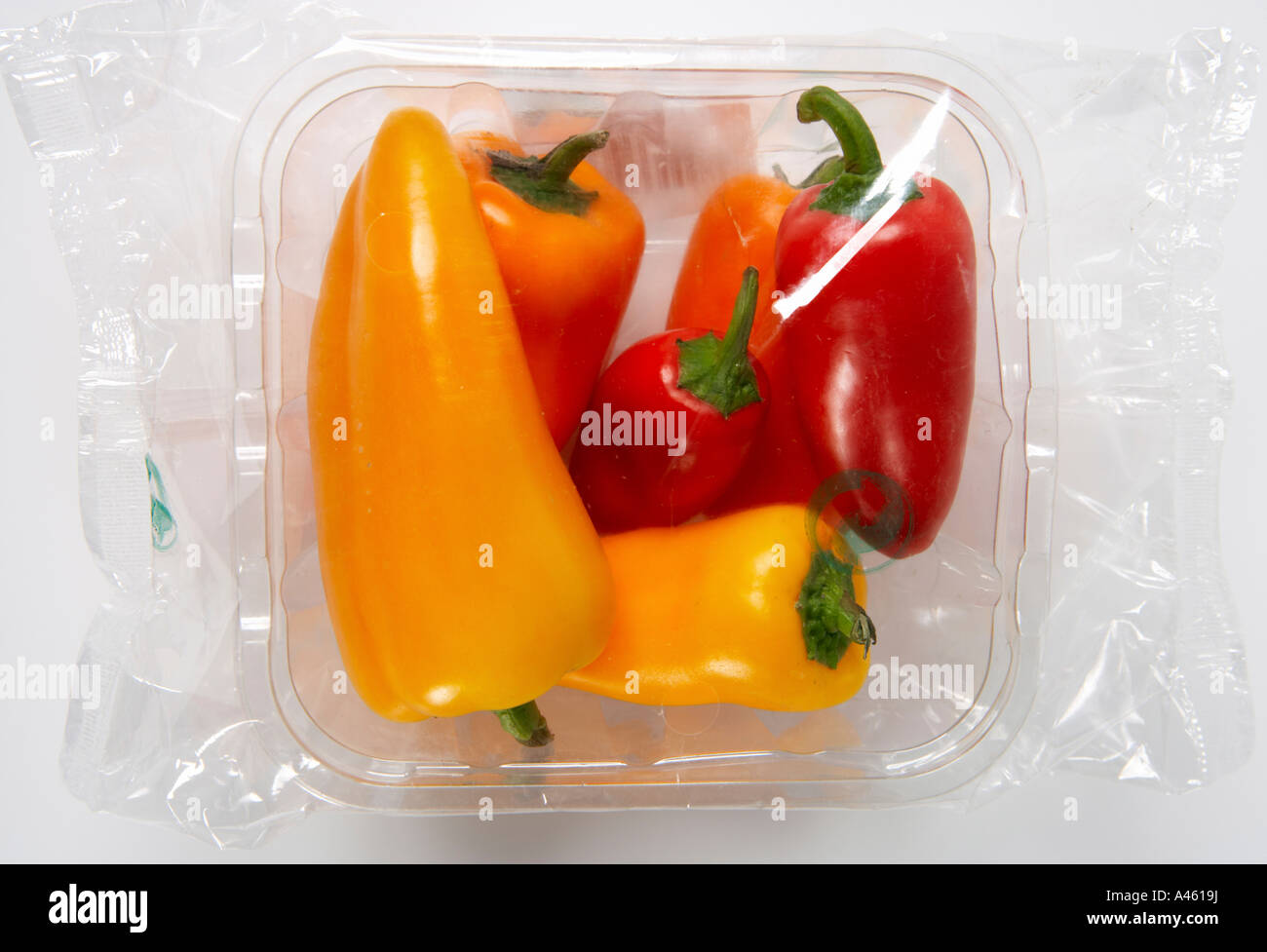 Packed bell peppers on white background Stock Photo - Alamy