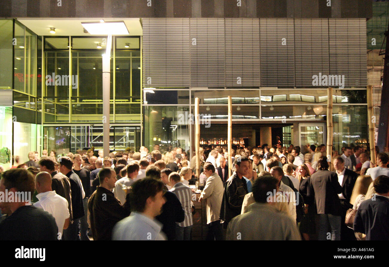 People in front of a club at the Castle Square, Stuttgart, Germany ...