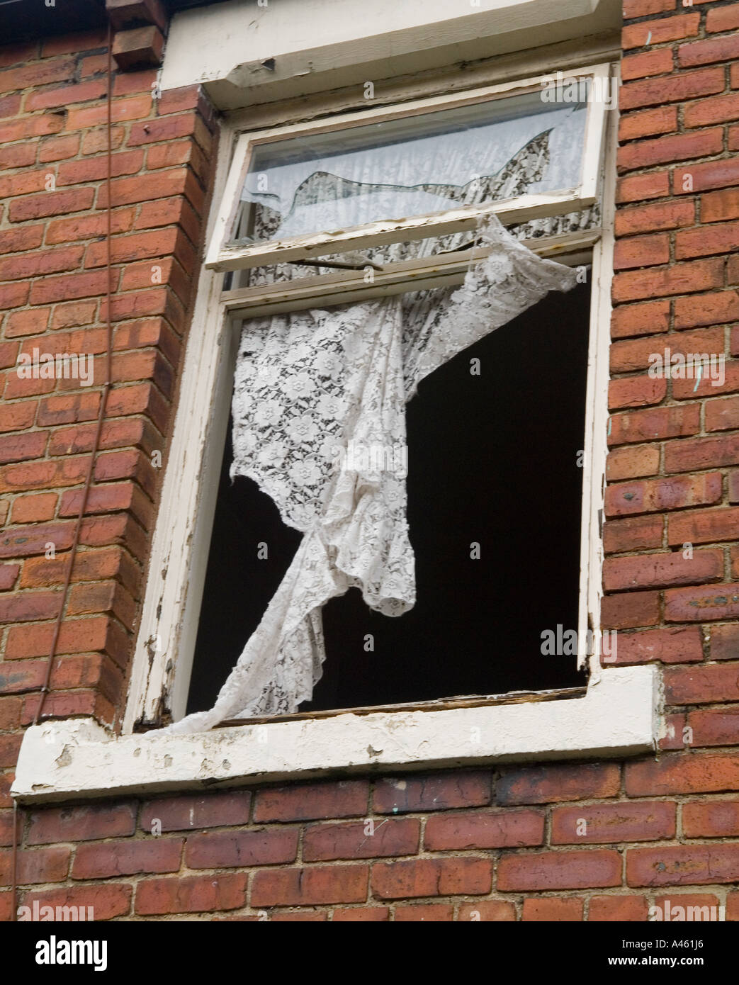 Broken window in a derelict house in Easington Colliery, County Durham ...