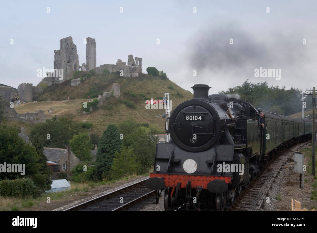 ENGLAND Dorset Corfe Castle seen behind a railway line with a steam ...