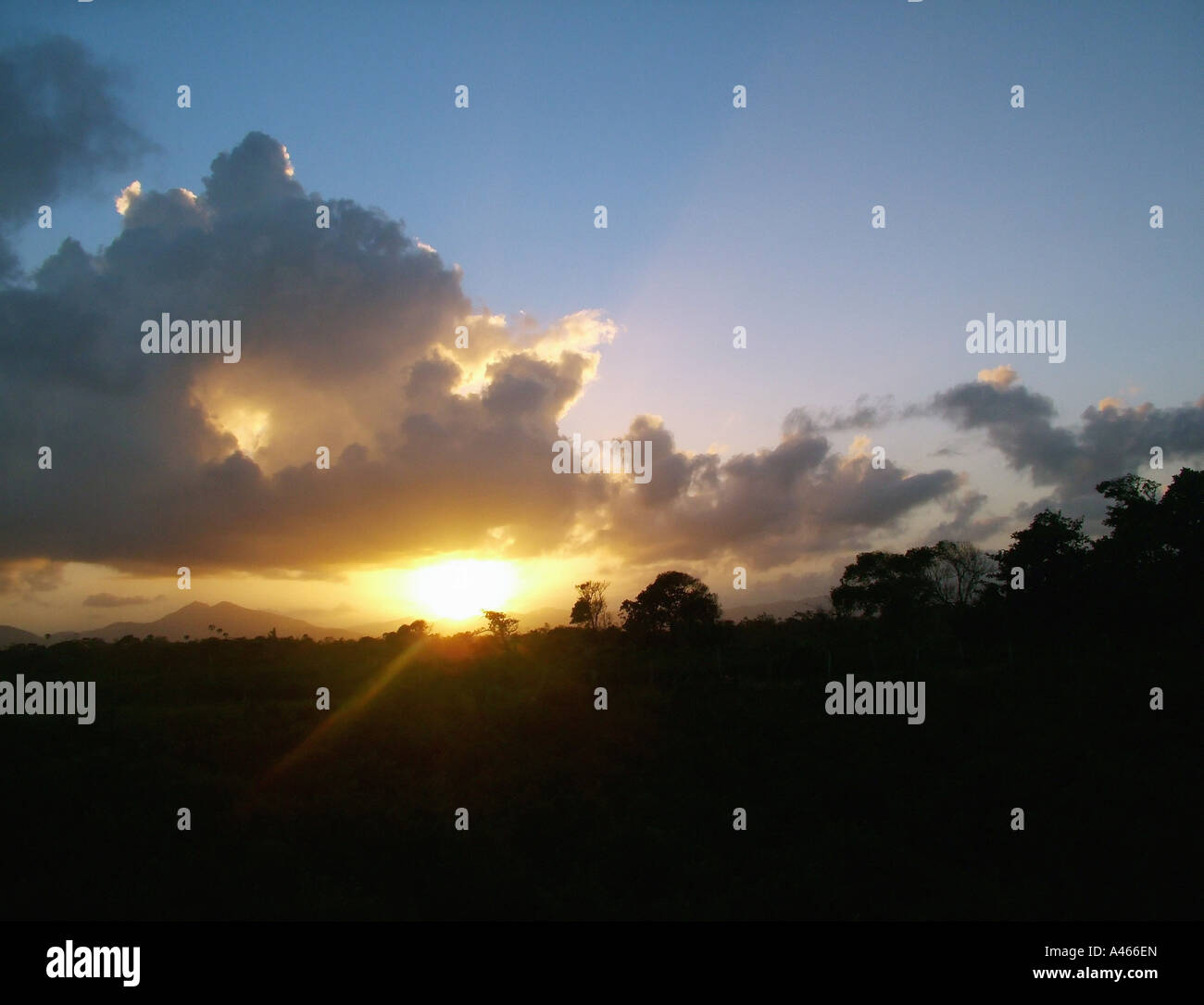 Sunburst sunset through clouds Stock Photo - Alamy