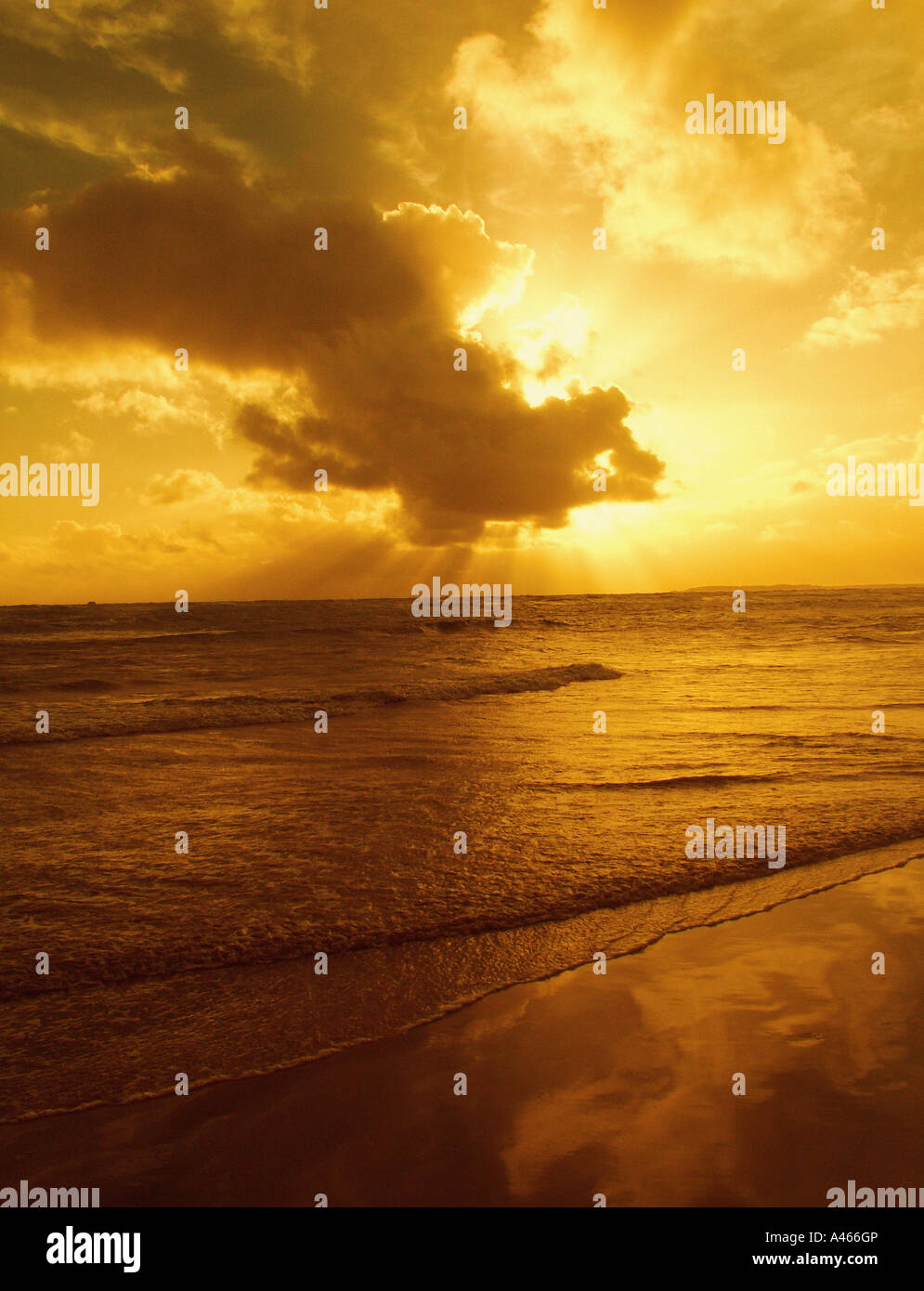 Golden morning sunburst over ocean Stock Photo - Alamy