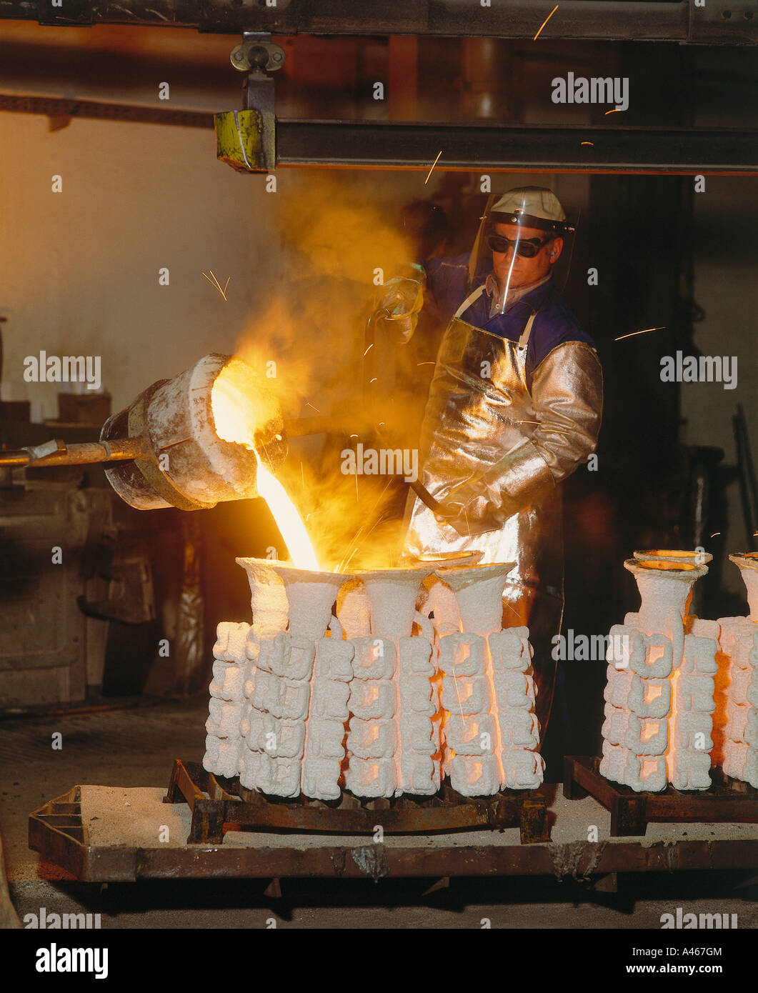 A worker pouring molten aluminium, Berlin, Germany Stock Photo - Alamy