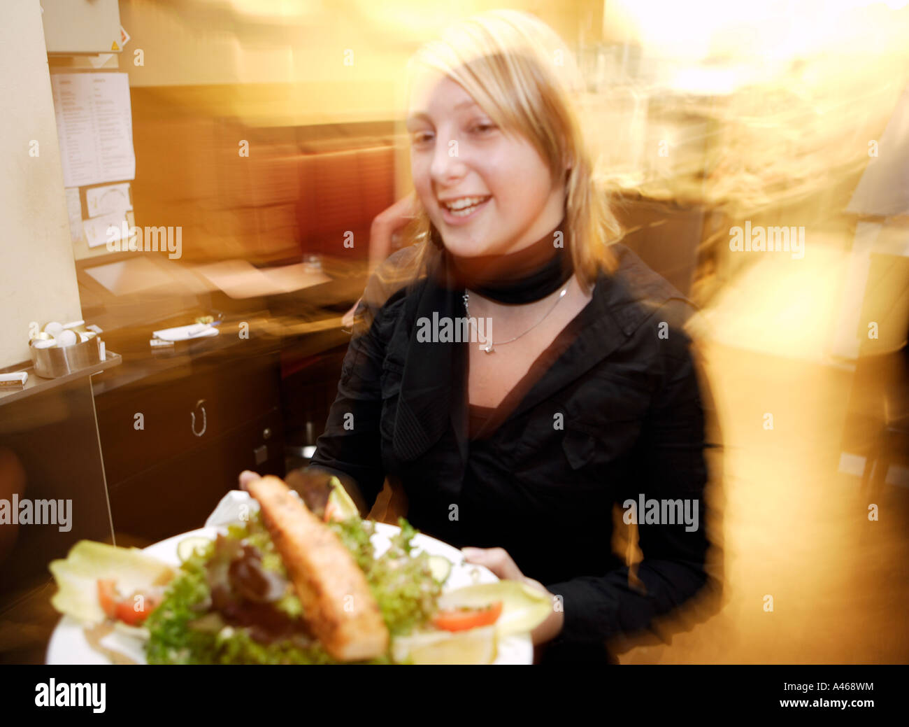 Waitress serves the meal Stock Photo - Alamy