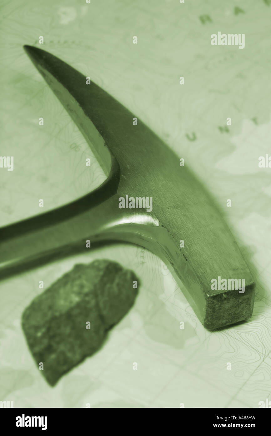 Mining concept with geologists rock hammer map and mineral Stock Photo ...