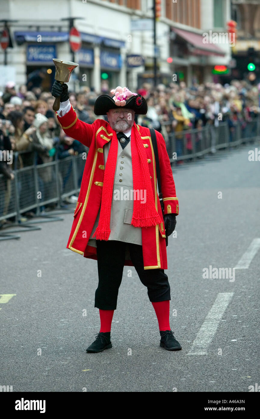 Traditional English town crier ringing bell, Chinese New Year parade ...