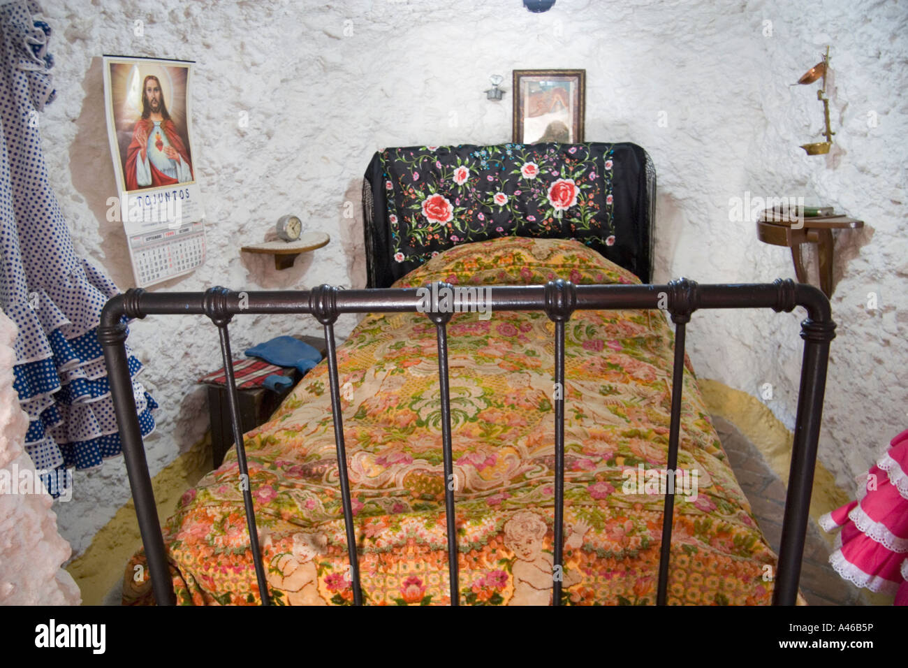 A bedroom inside a gypsy's cave house in the Sacromonte region of ...